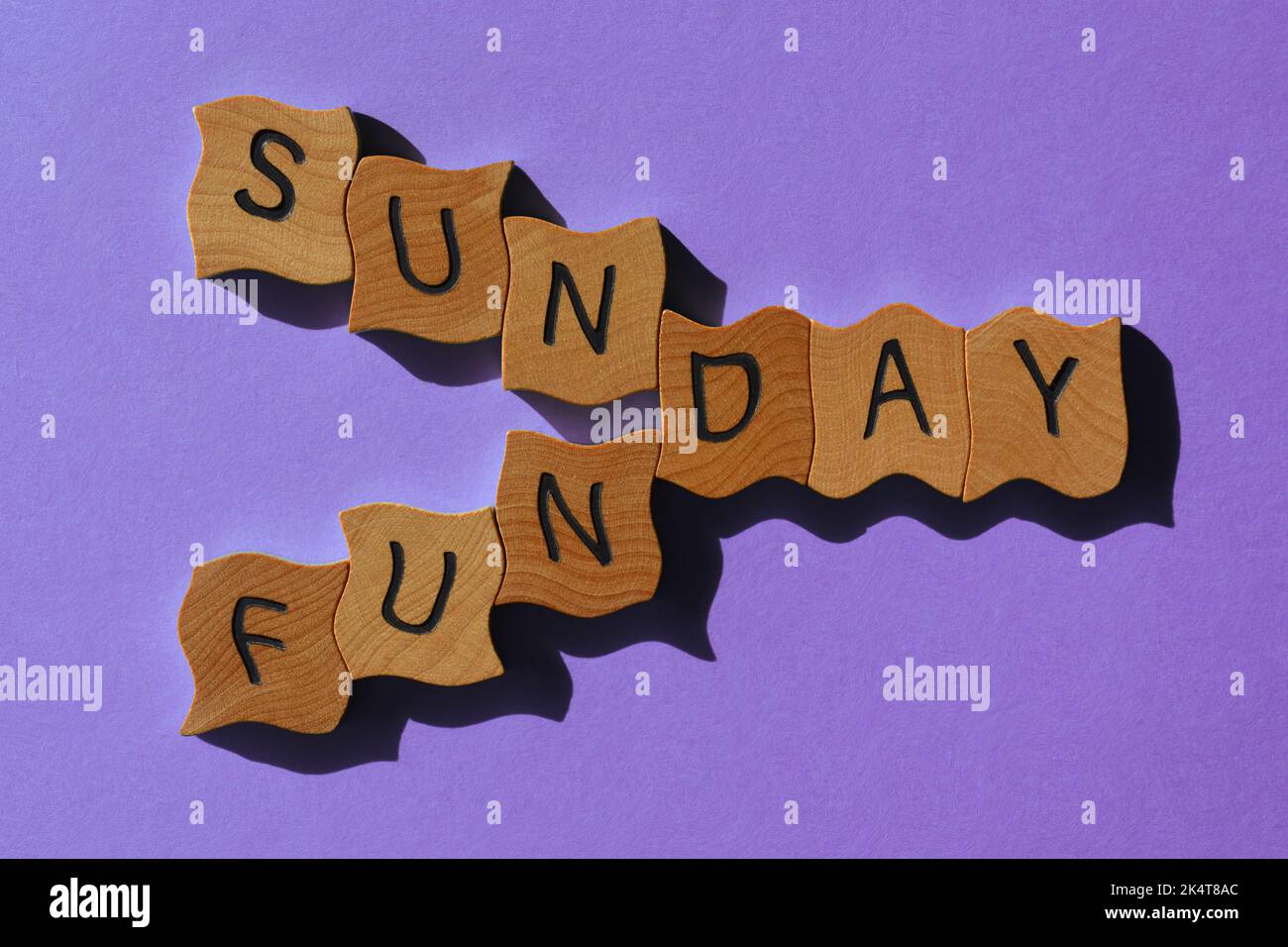 Sunday, Funday, words in wooden alphabet letters isolated on blue ...