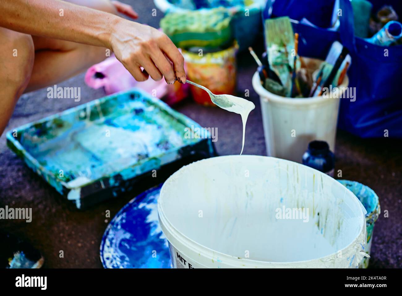 Construction painter prepares mixes different paints for art work Stock ...