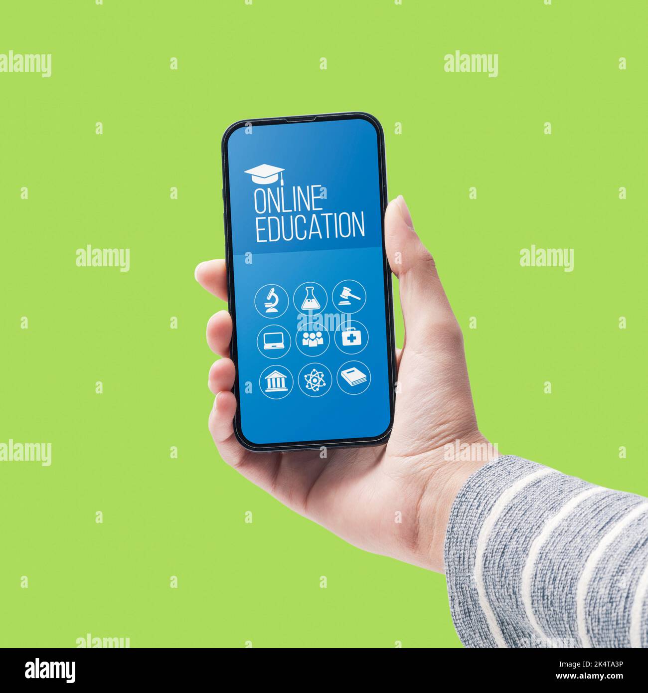 Student holding a smartphone and using online learning apps on ...