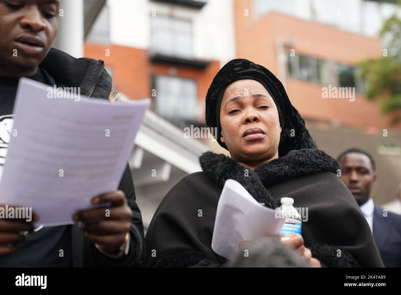 Chris Kaba's cousin Jefferson Bosela reads a statement outside Inner ...
