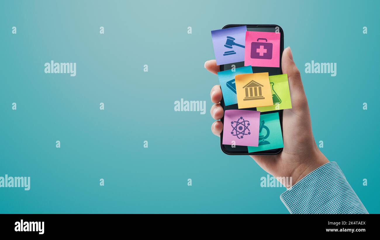 Online learning and educational apps on smartphone, sticky notes with ...