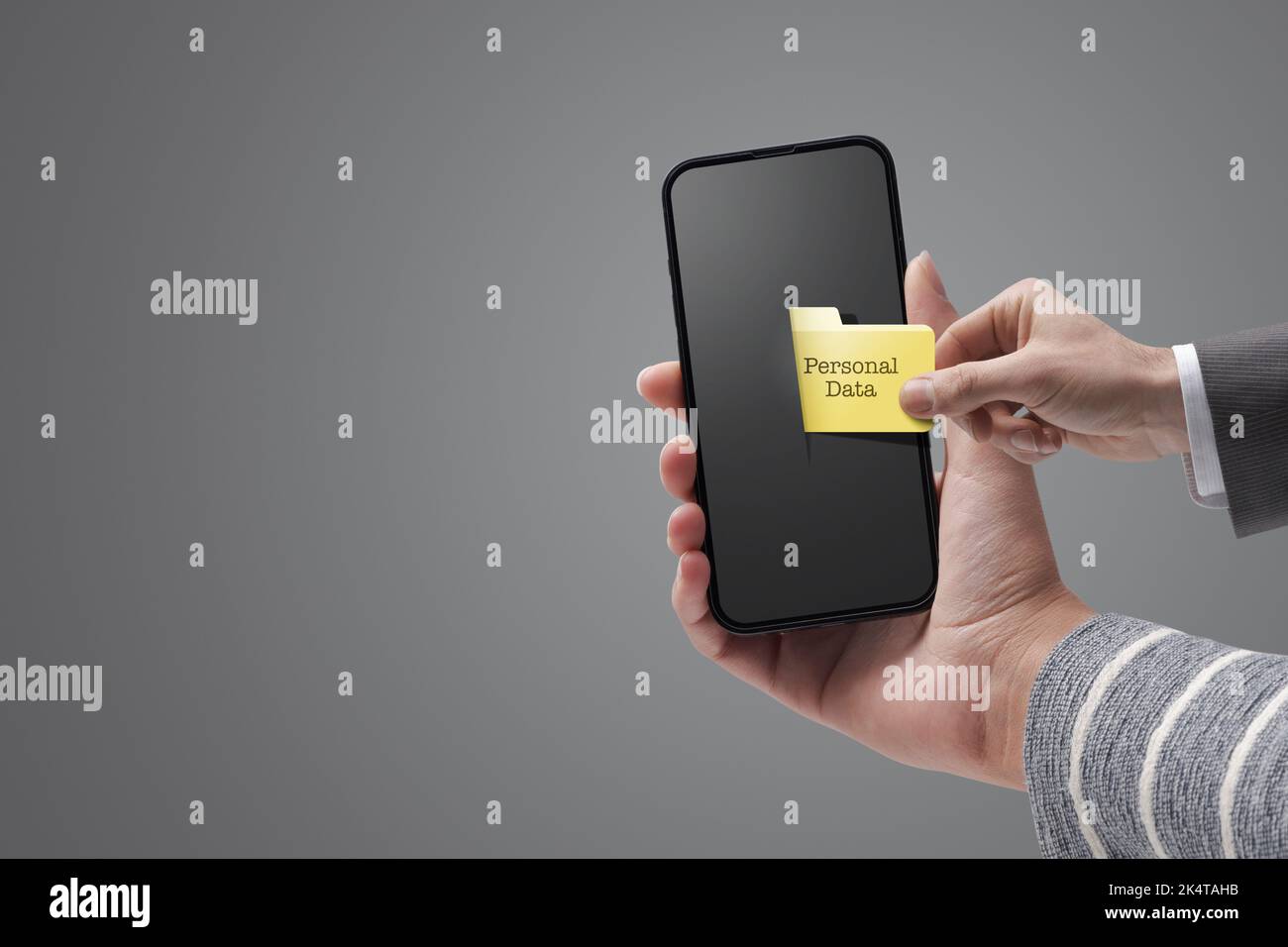 Businessman stealing a user's personal data stored in his smartphone ...