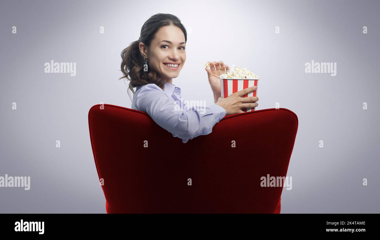 Woman eating popcorn and watching movies, entertainment and cinema ...