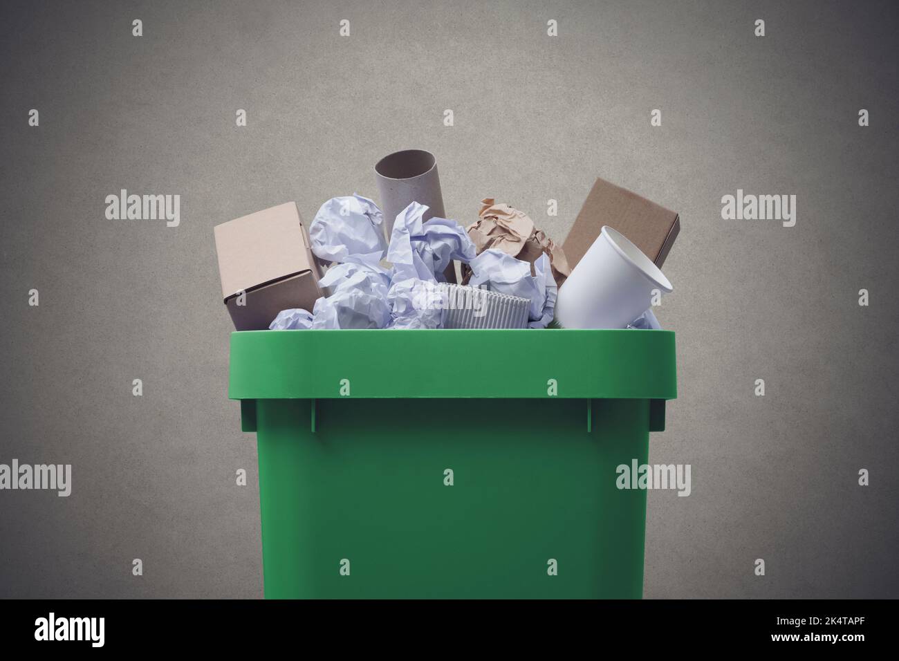 Garbage can full of paper waste, recycling and separate waste ...