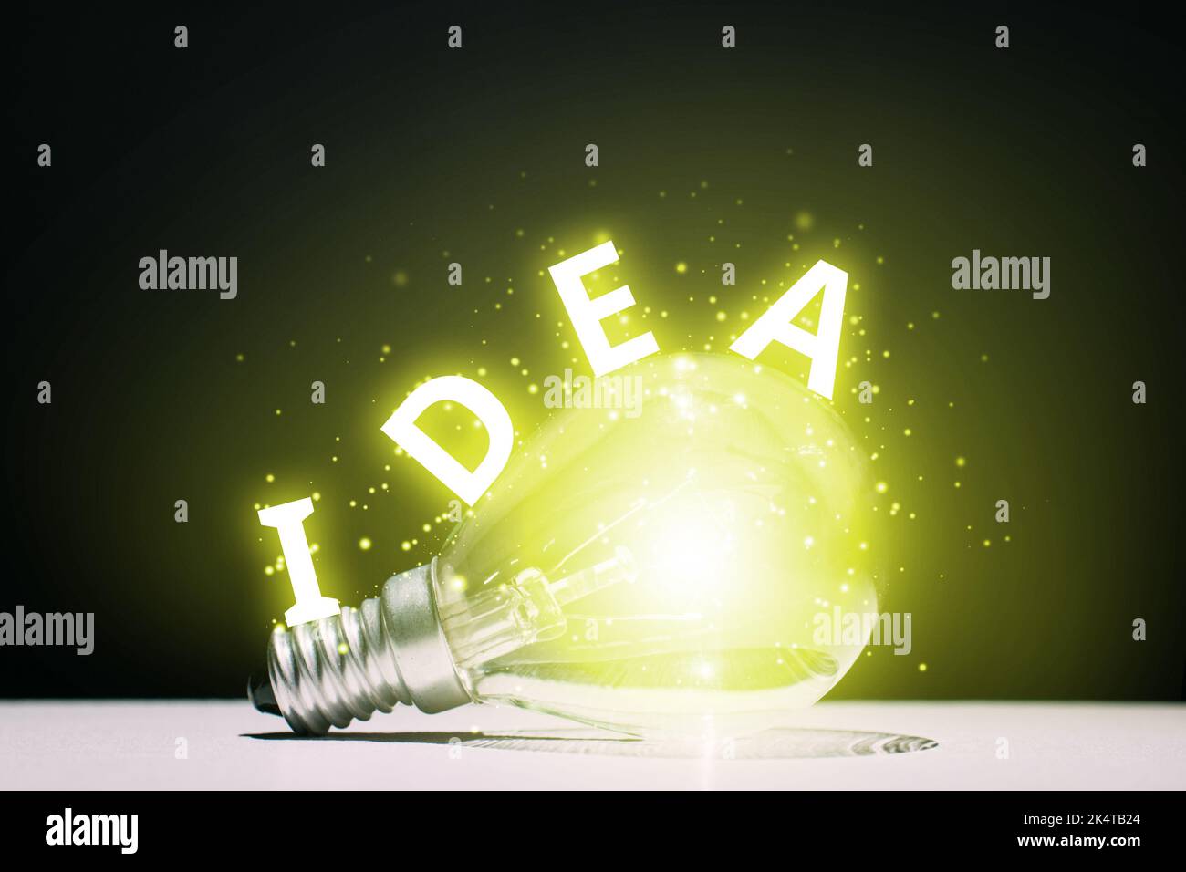 The concept of creativity and idea generation. Light bulb glowing with ...