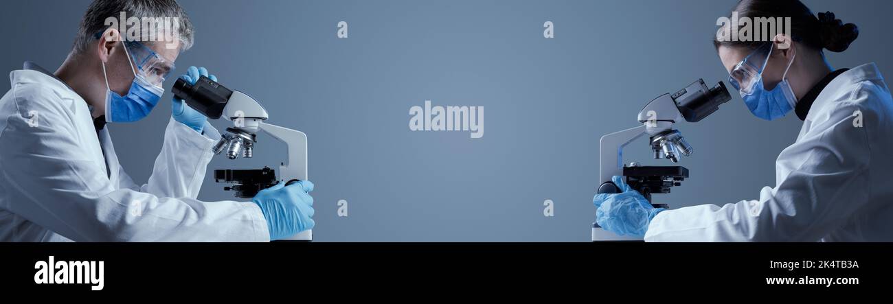 Medical team at work, they are analyzing samples under microscopes ...