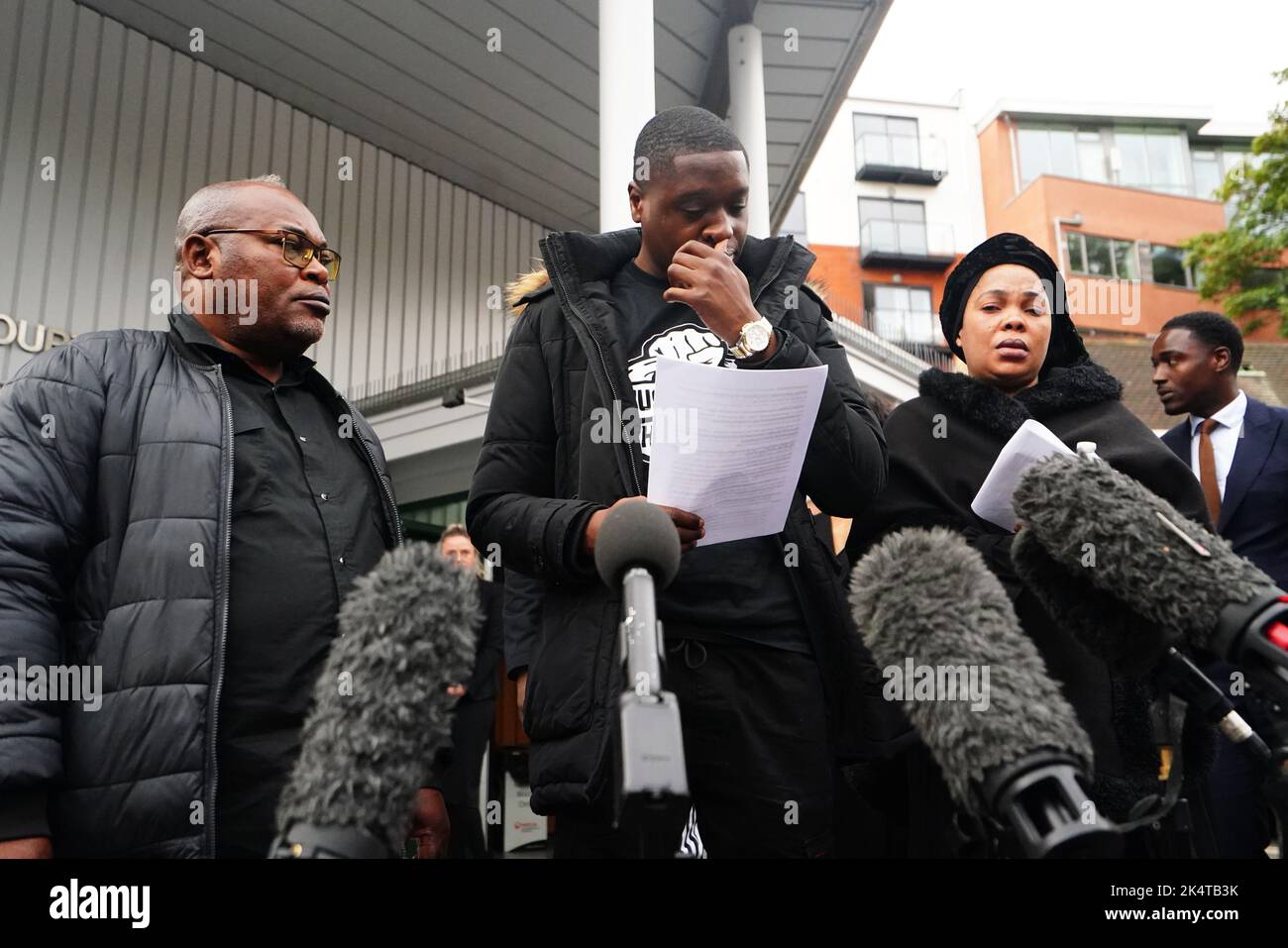 Chris Kaba's cousin Jefferson Bosela reads a statement outside Inner ...