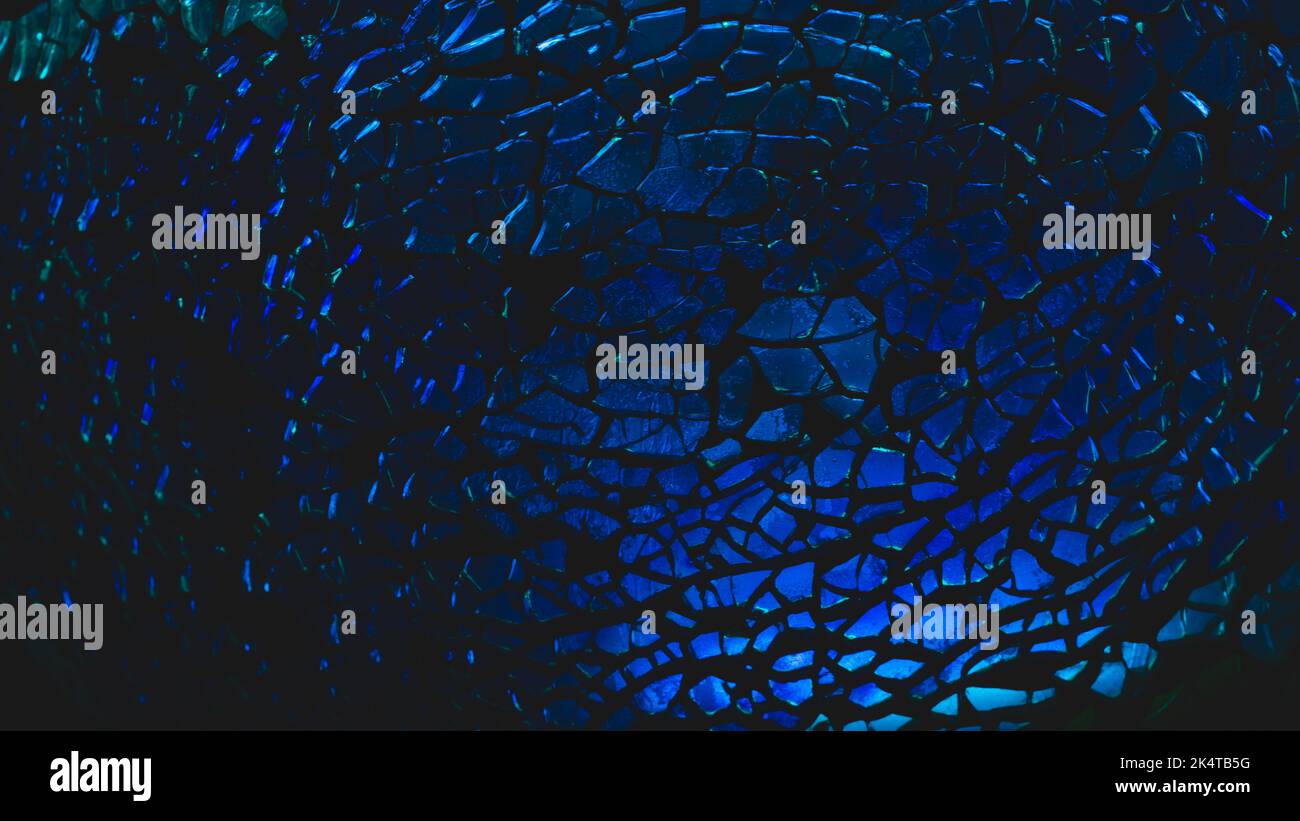 Shattered transparent glass pattern in the dark. abstract cracked ...
