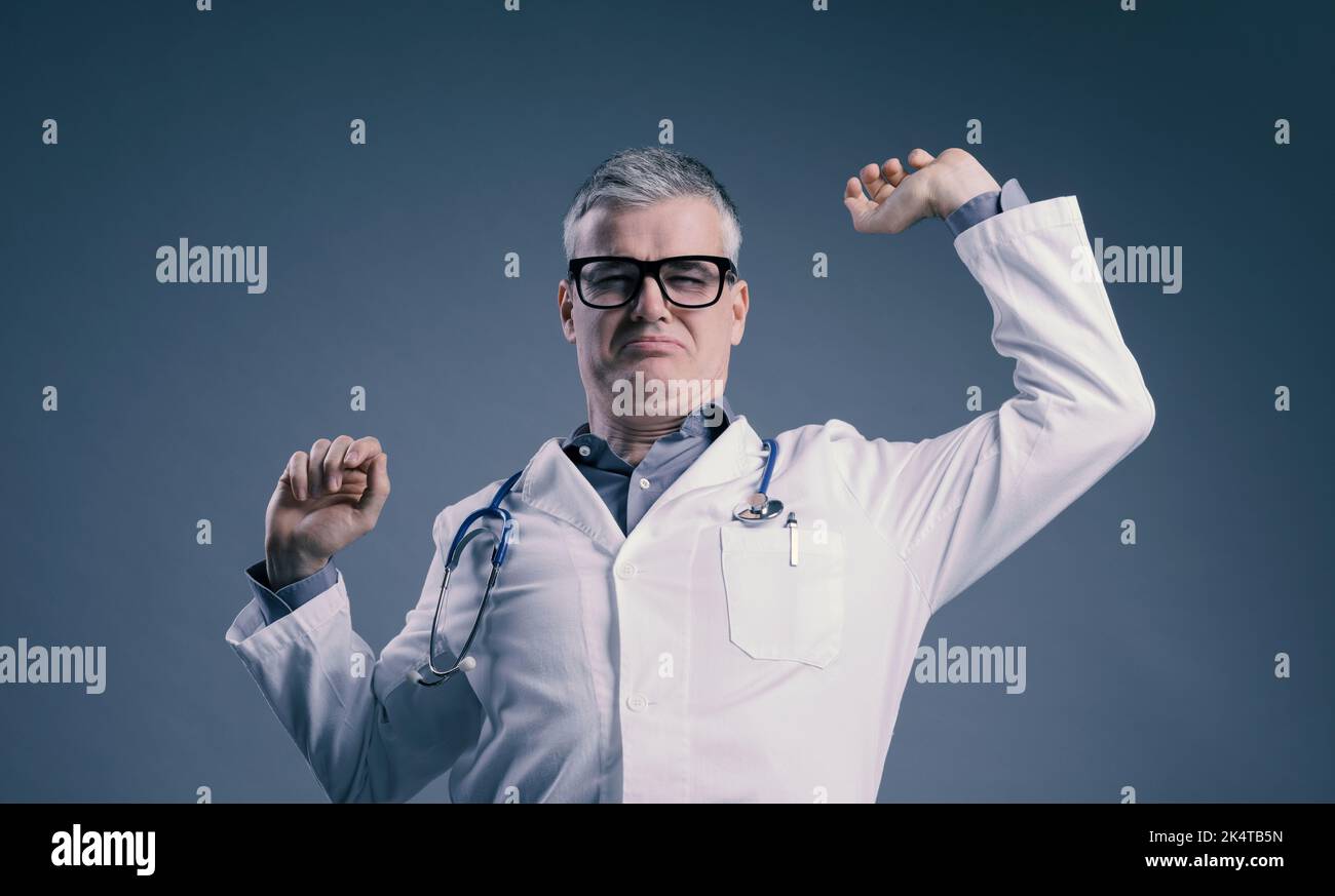 Lazy sleepy doctor stretching his arms, he is tired and overworked ...