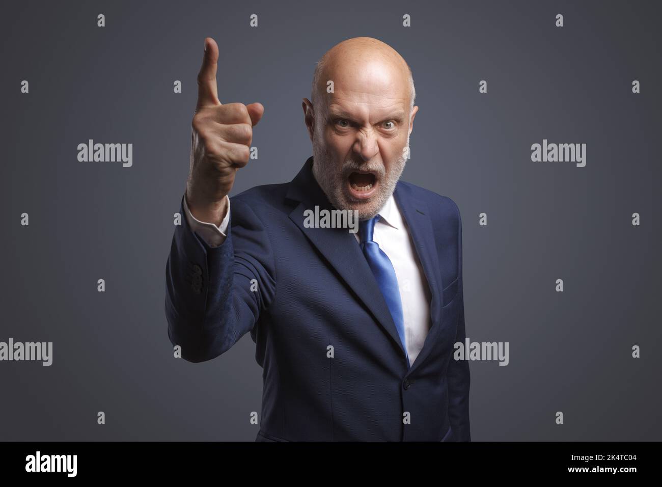 Angry boss shouting at camera, he is scolding an employee Stock Photo ...
