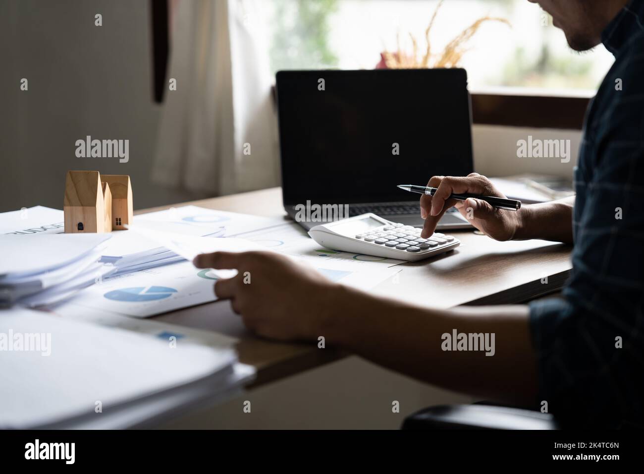 Business accounting concept, Business man using calculator with ... Business accounting concept, Business man using calculator with ...