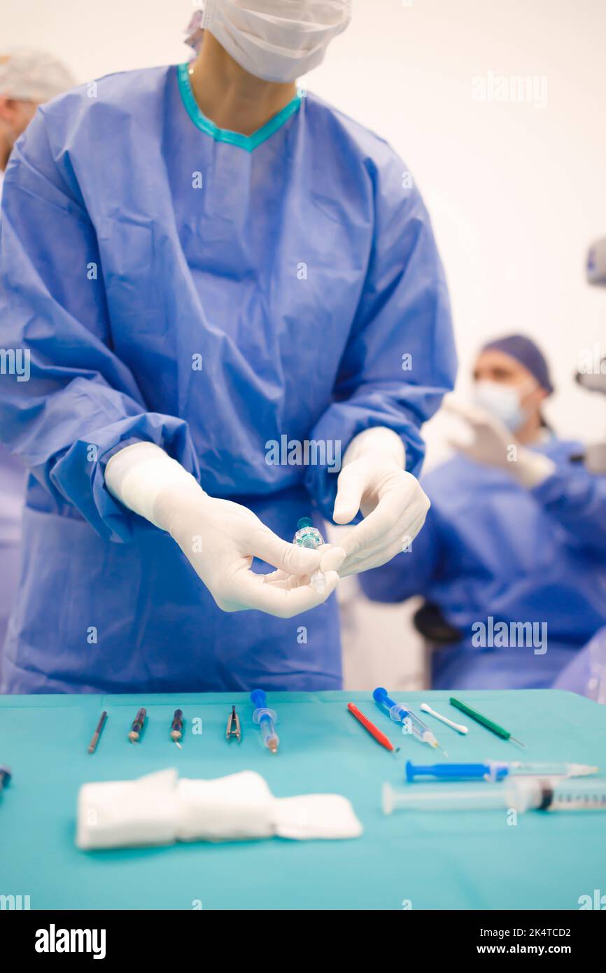 Nurse assistant prepares instruments for surgery Stock Photo - Alamy