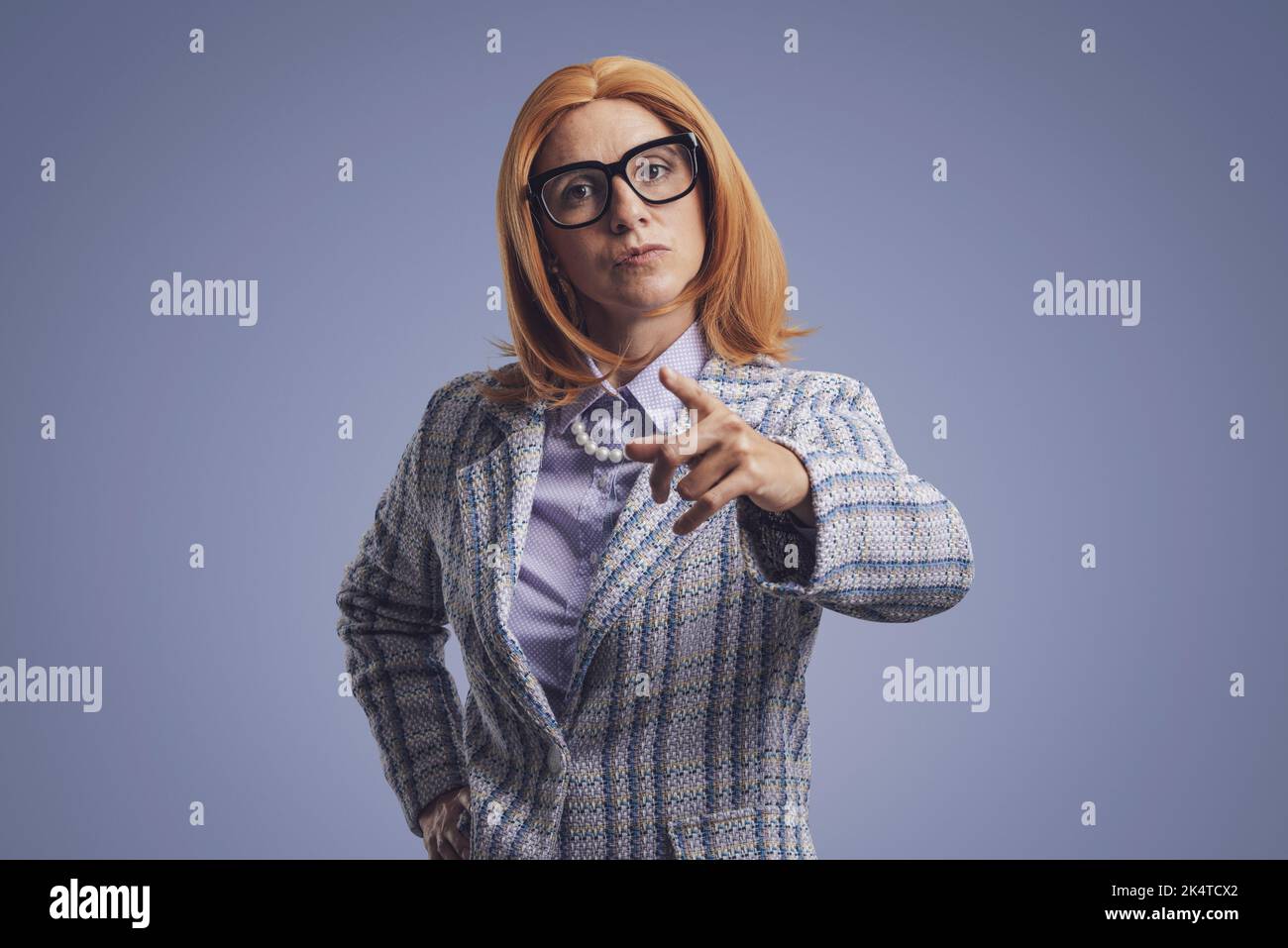Aggressive confident woman pointing at camera and giving orders, blank ...