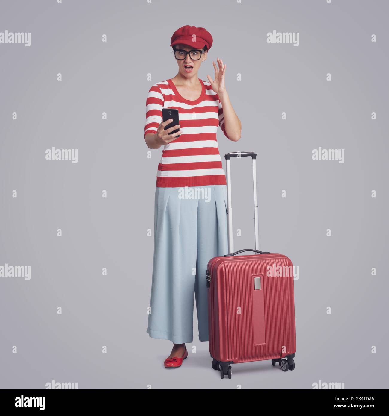 Shocked disappointed female traveler with luggage, she is having ...