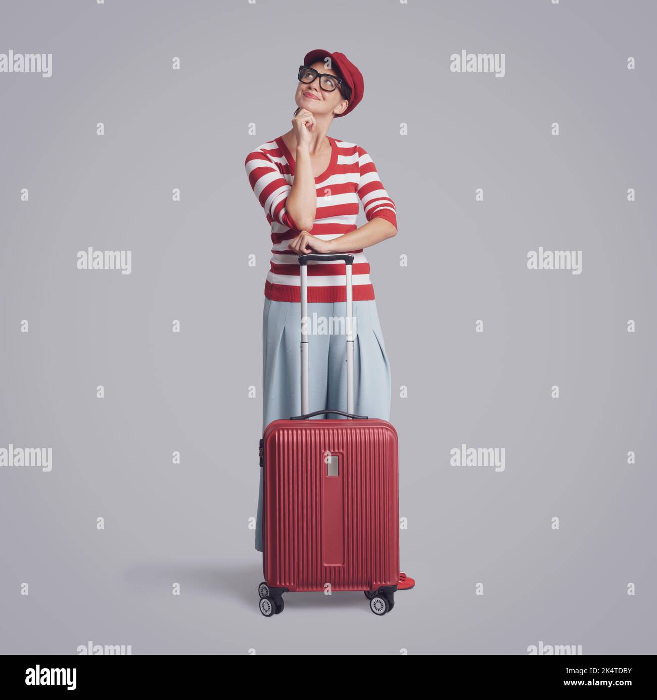 Happy traveler woman thinking with hand on chin, travel and ...