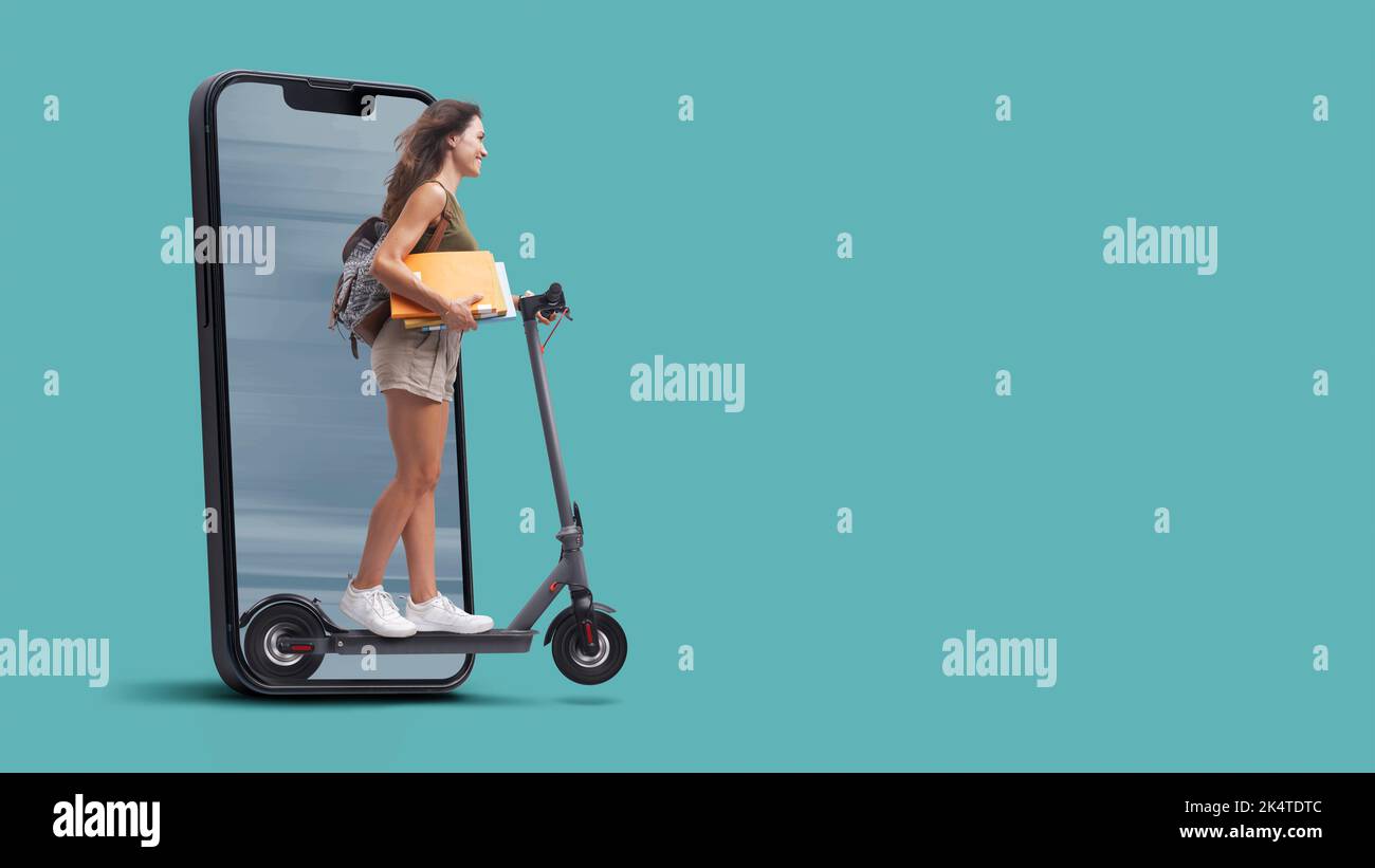 Happy young student riding an eco-friendly electric scooter, she is ...