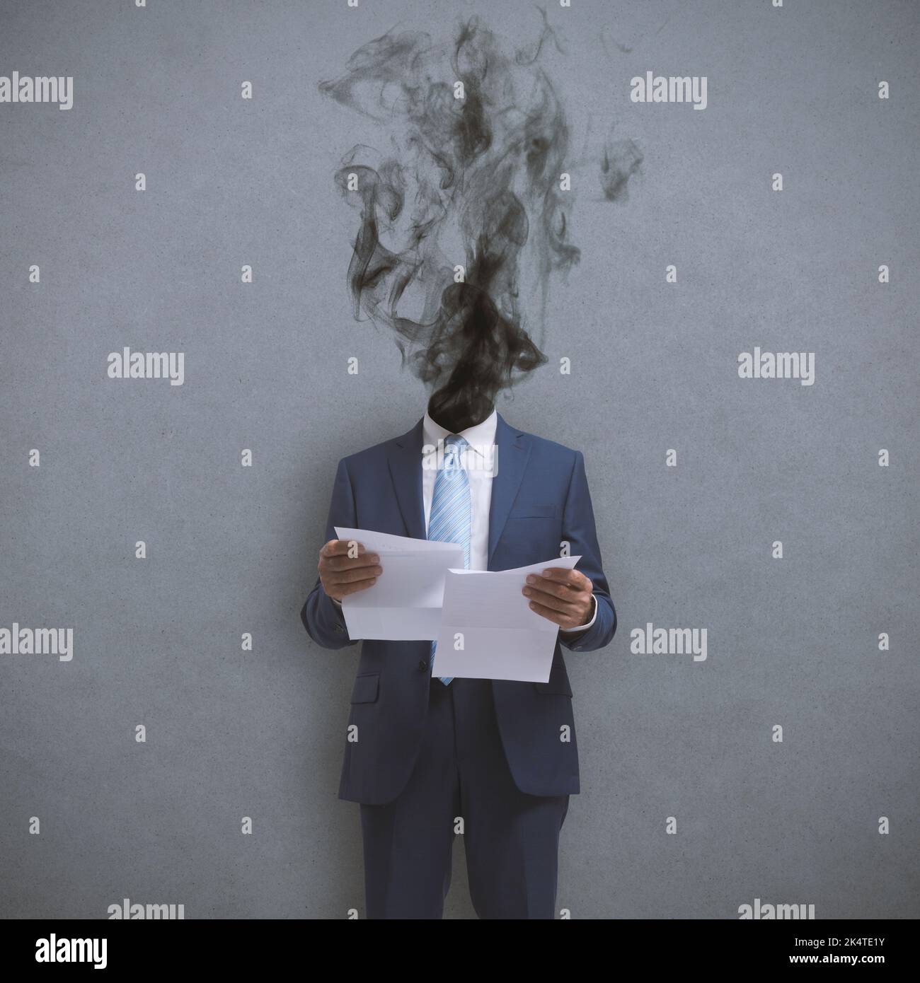 Angry businessman with smoke in place of his head holding expensive ...