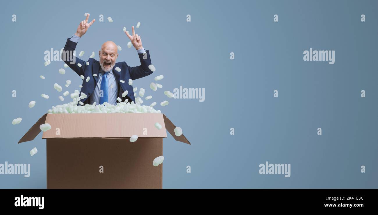 Cheerful senior businessman celebrating his success and coming out from ...