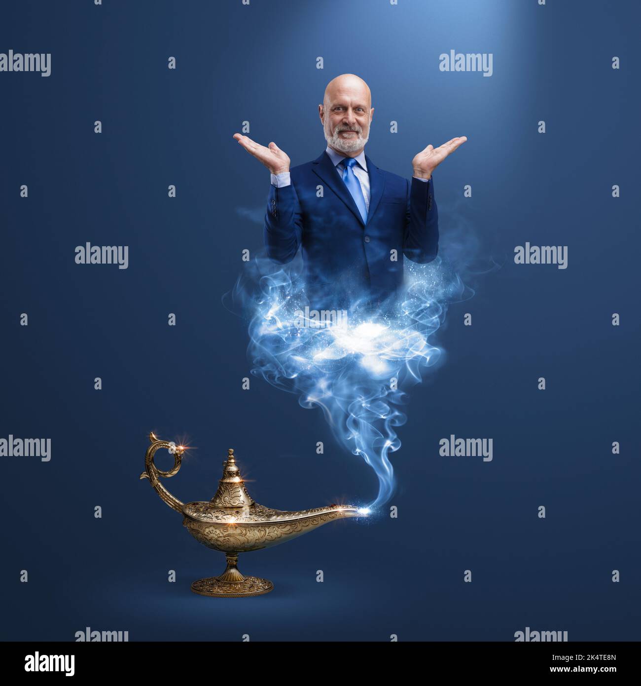 Corporate businessman genie coming out from a magic lamp, he is smiling ...