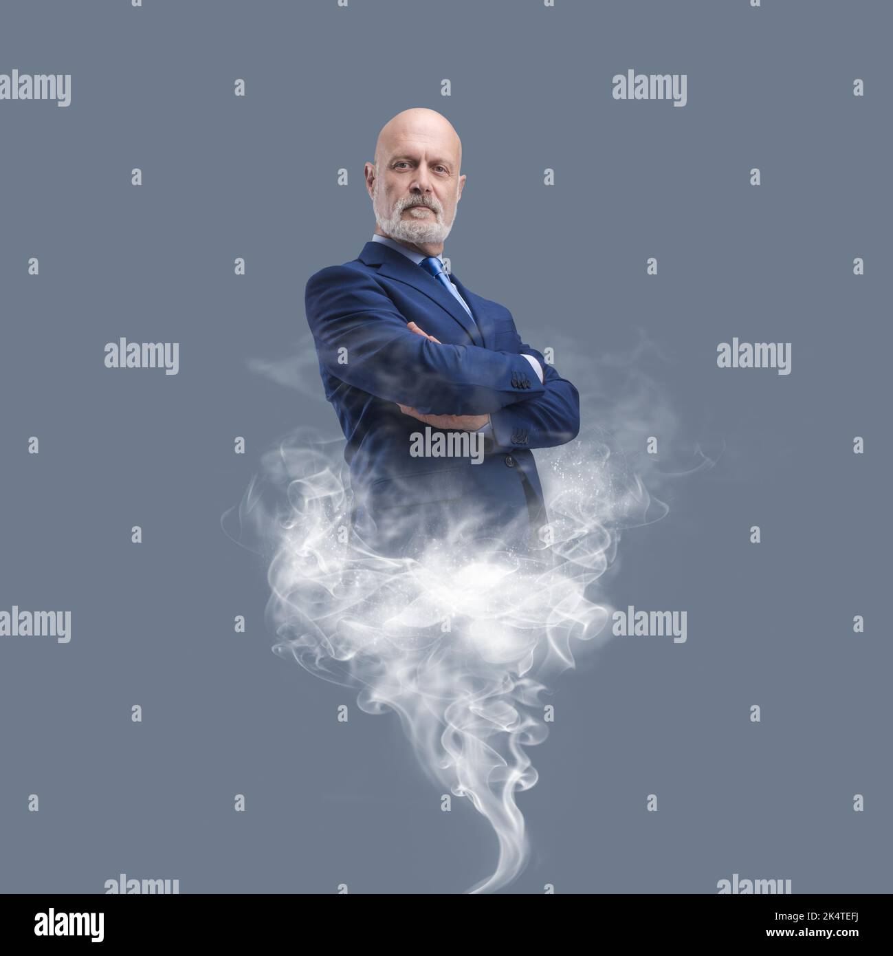 Confident businessman genie appearing and smoke, he is posing with ...