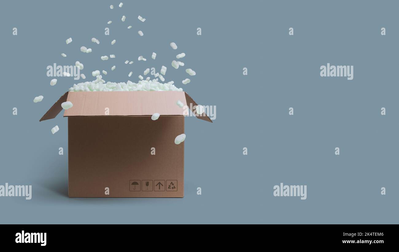 Open delivery box filled with polystyrene packing chips: shipment and ...
