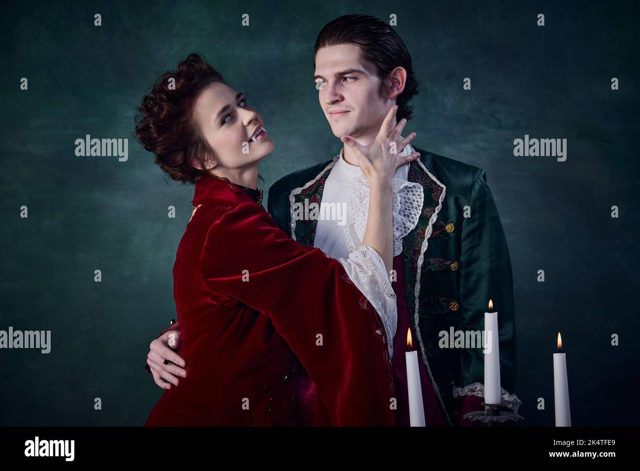 Portrait of beautiful woman with hypnotic eyes in image of vampire ...