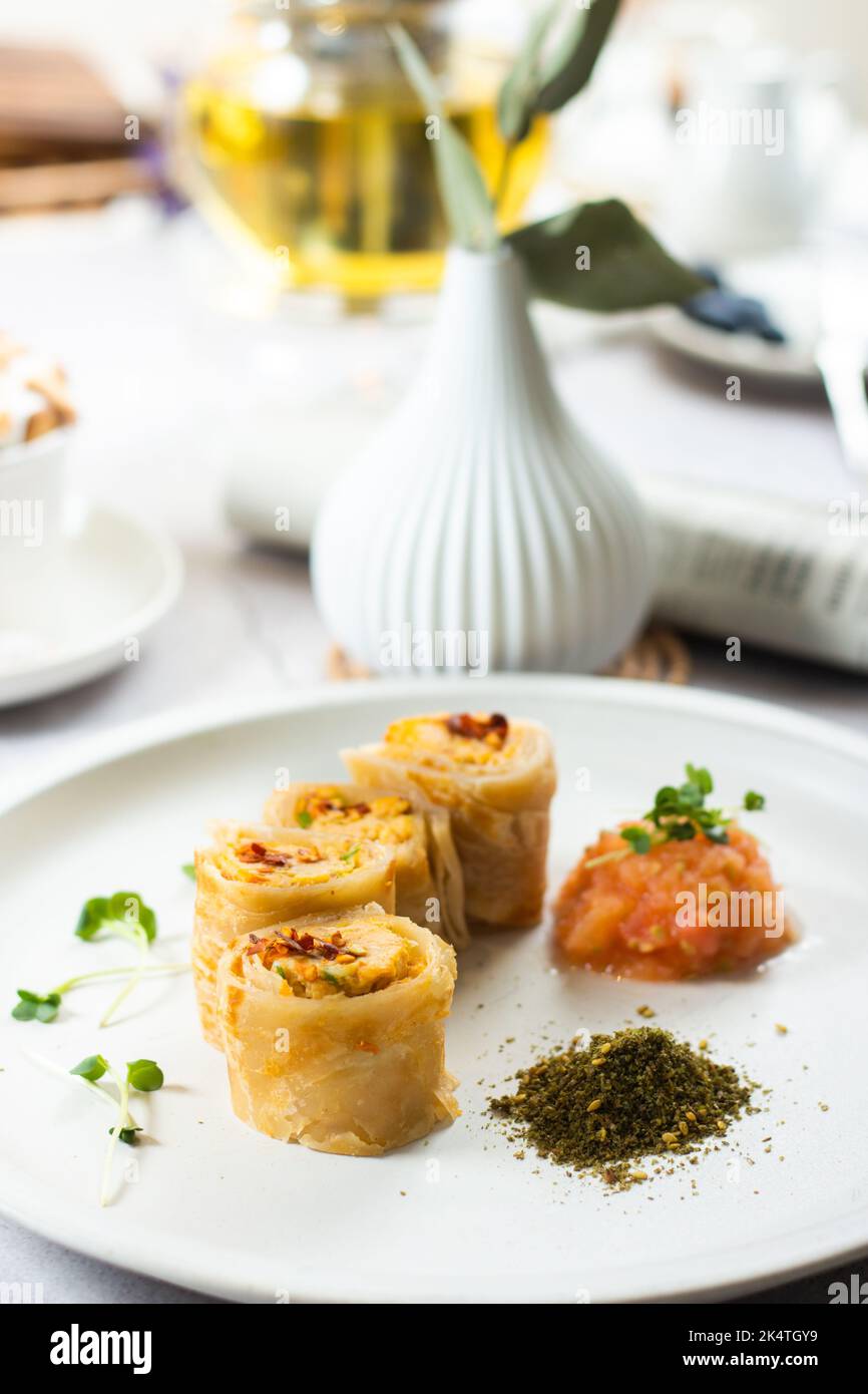 Delicious paratha roll and egg bhurji served with tomato sauce and dry ...