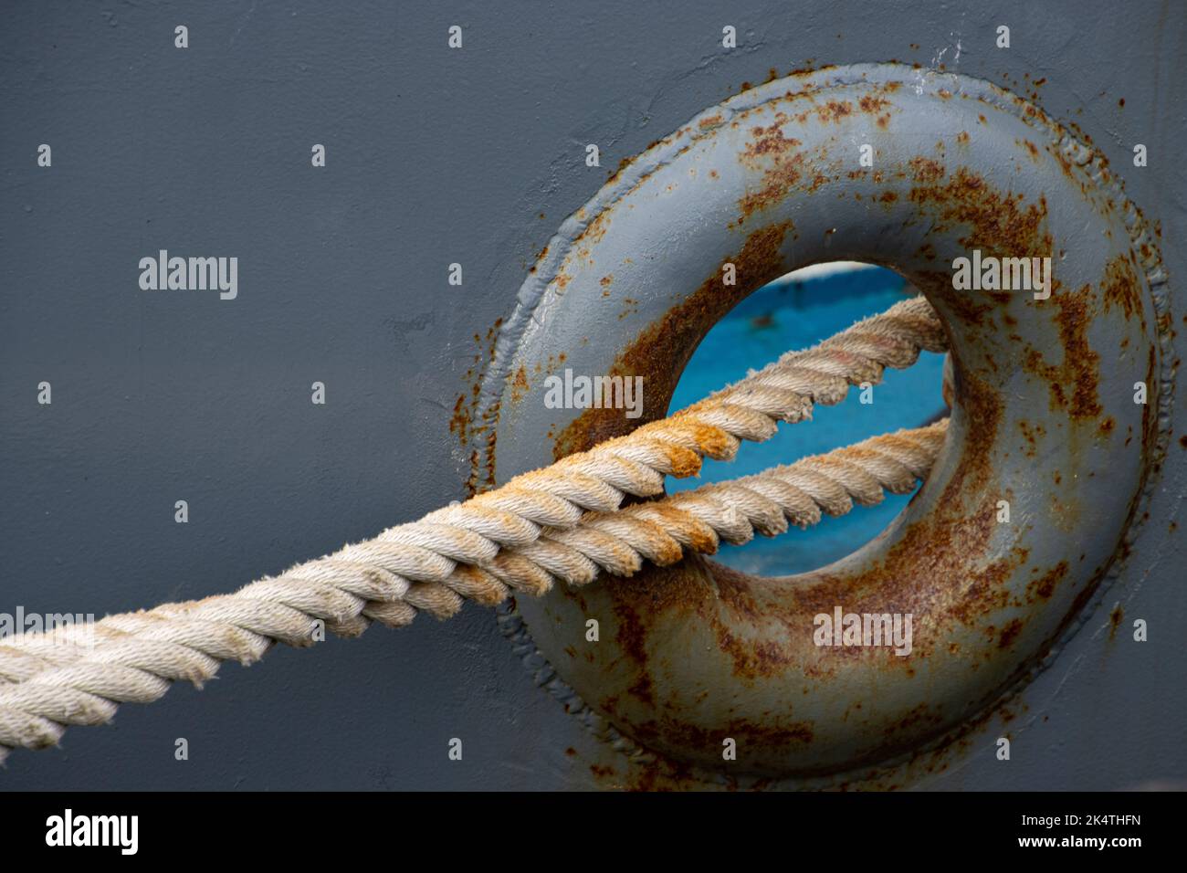 Close up of a mooring rope through a hole in a rusty boat Stock Photo ...