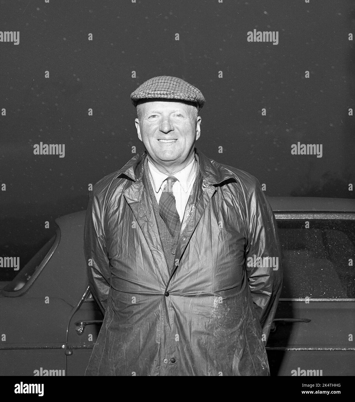 1965, historical, on wet, miserable day, a gentleman in a shirt & tie ...