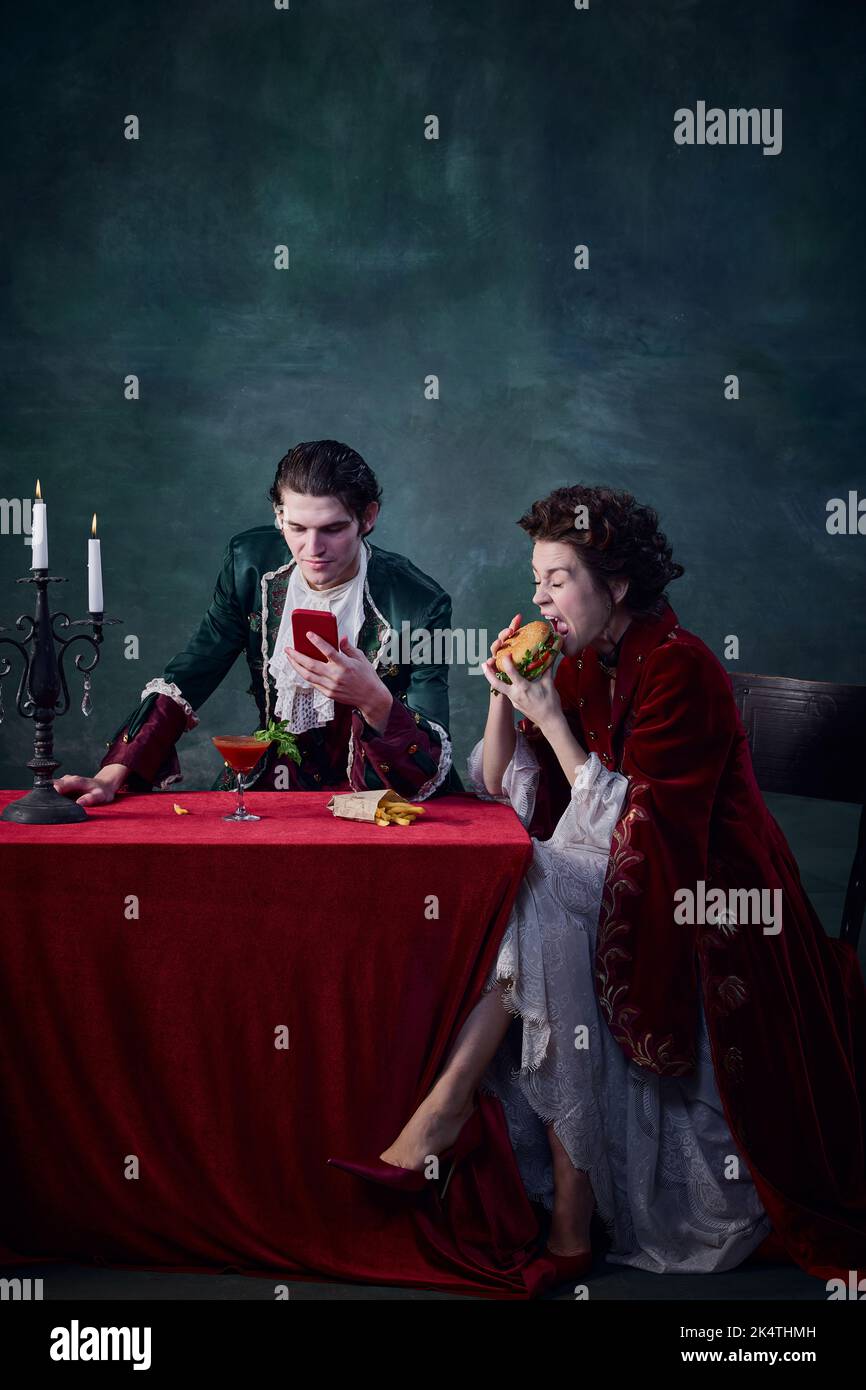 Portrait of people in image of medieval vampires over dark green ...
