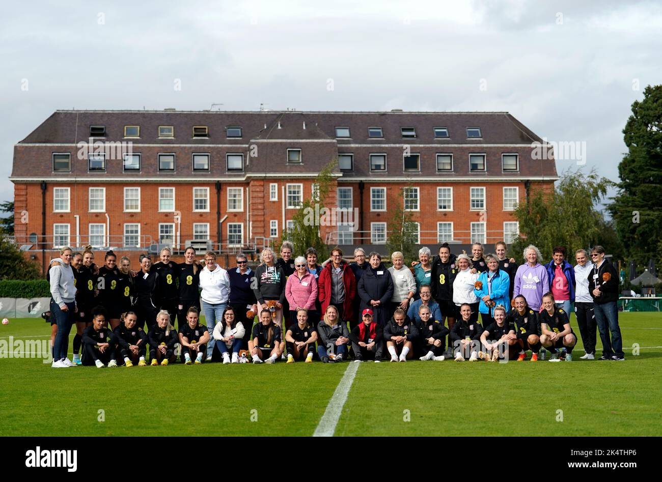 England players and former Lionesses pose for a group photograph during ...
