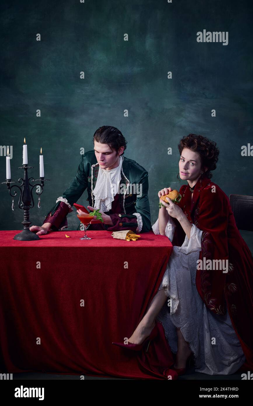 Portrait of people in image of medieval vampires over dark green ...
