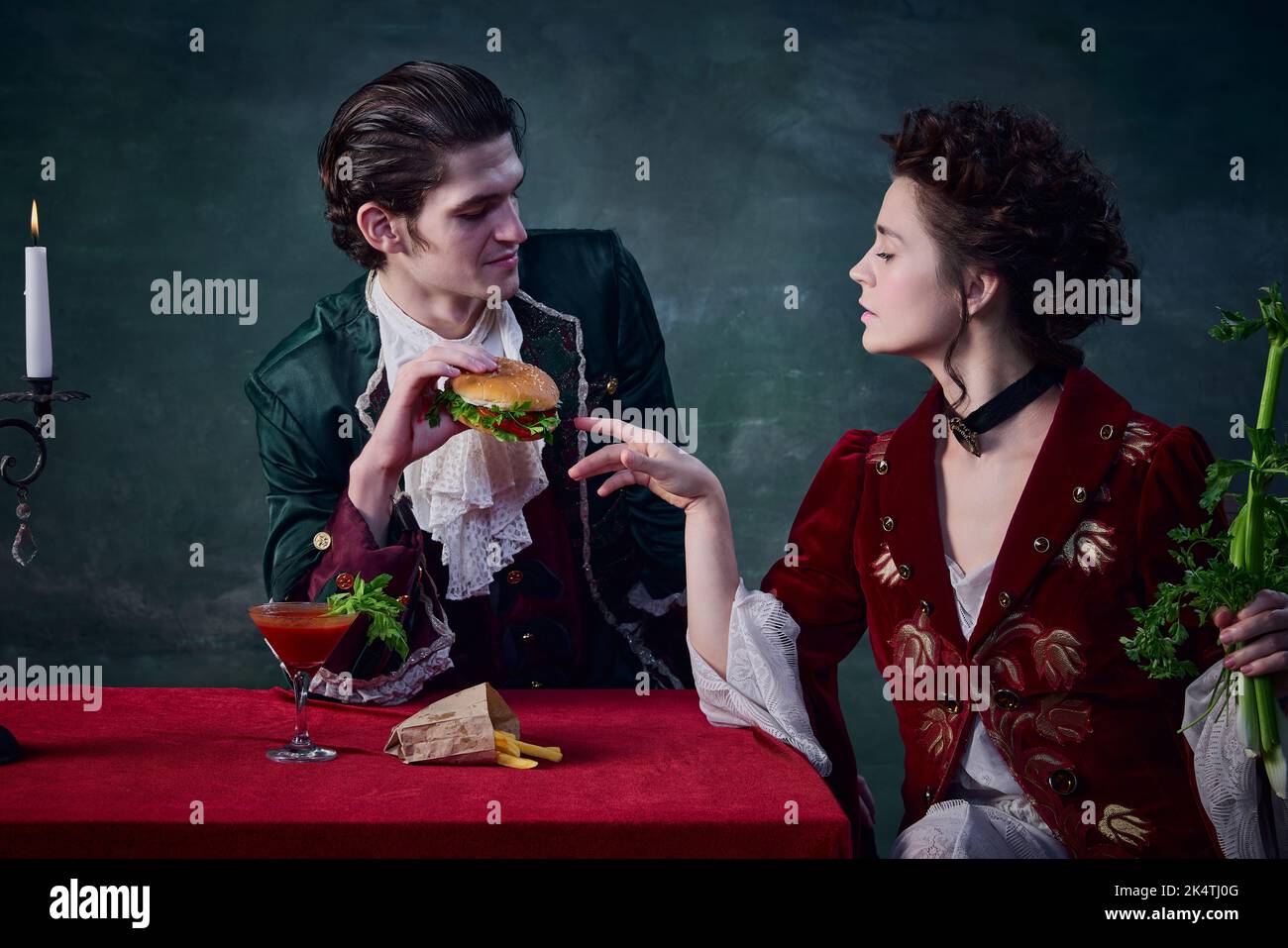 Portrait of people in image of vampires over dark green background. Man ...