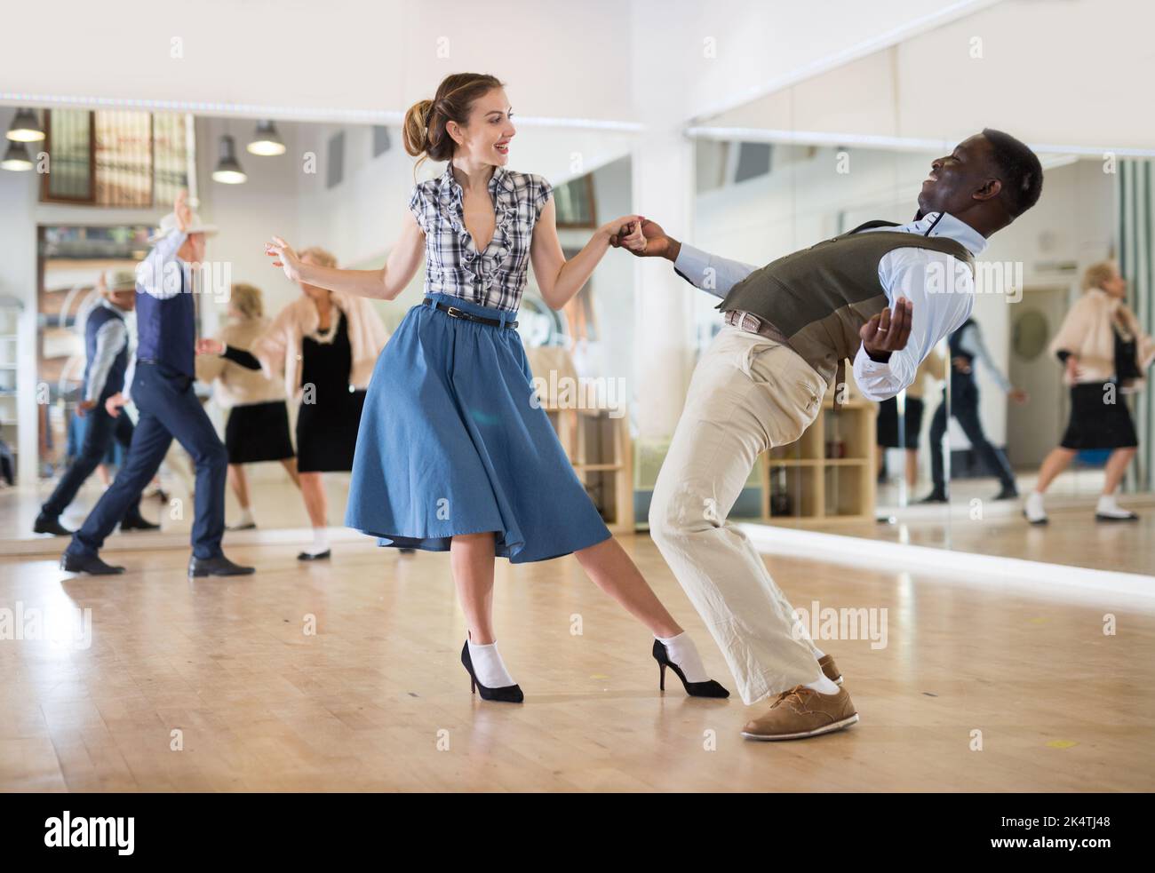 Woman and man dancing swing in studio Stock Photo - Alamy