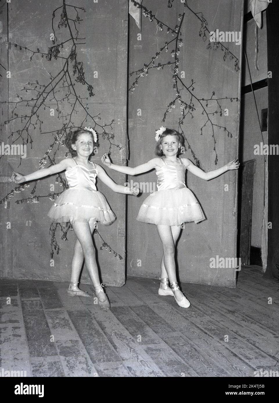 1961, historical, two young girls in their ballet costumes performing ...