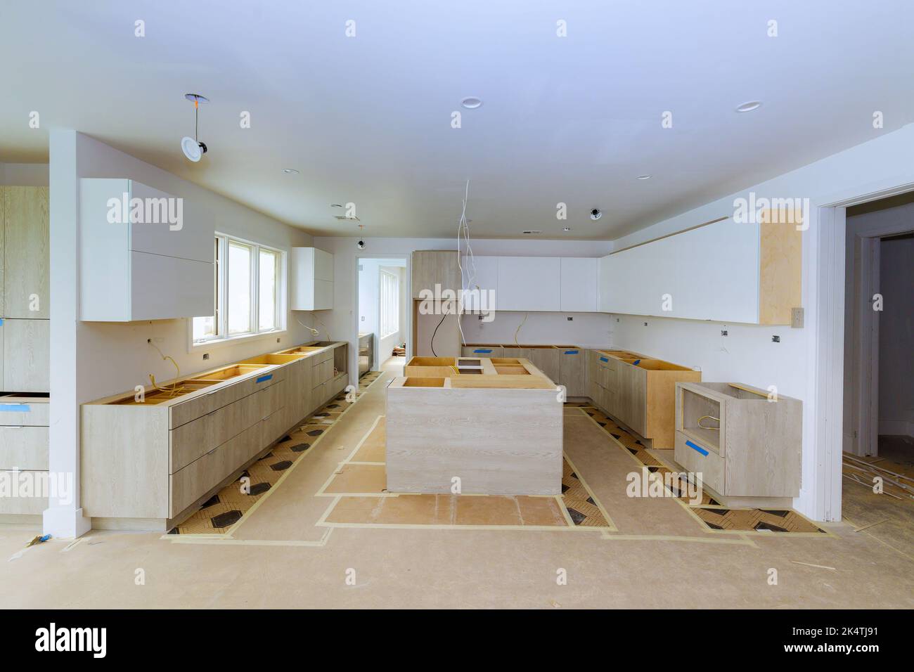 A newly built house was fitted with white kitchen cabinets that were ...