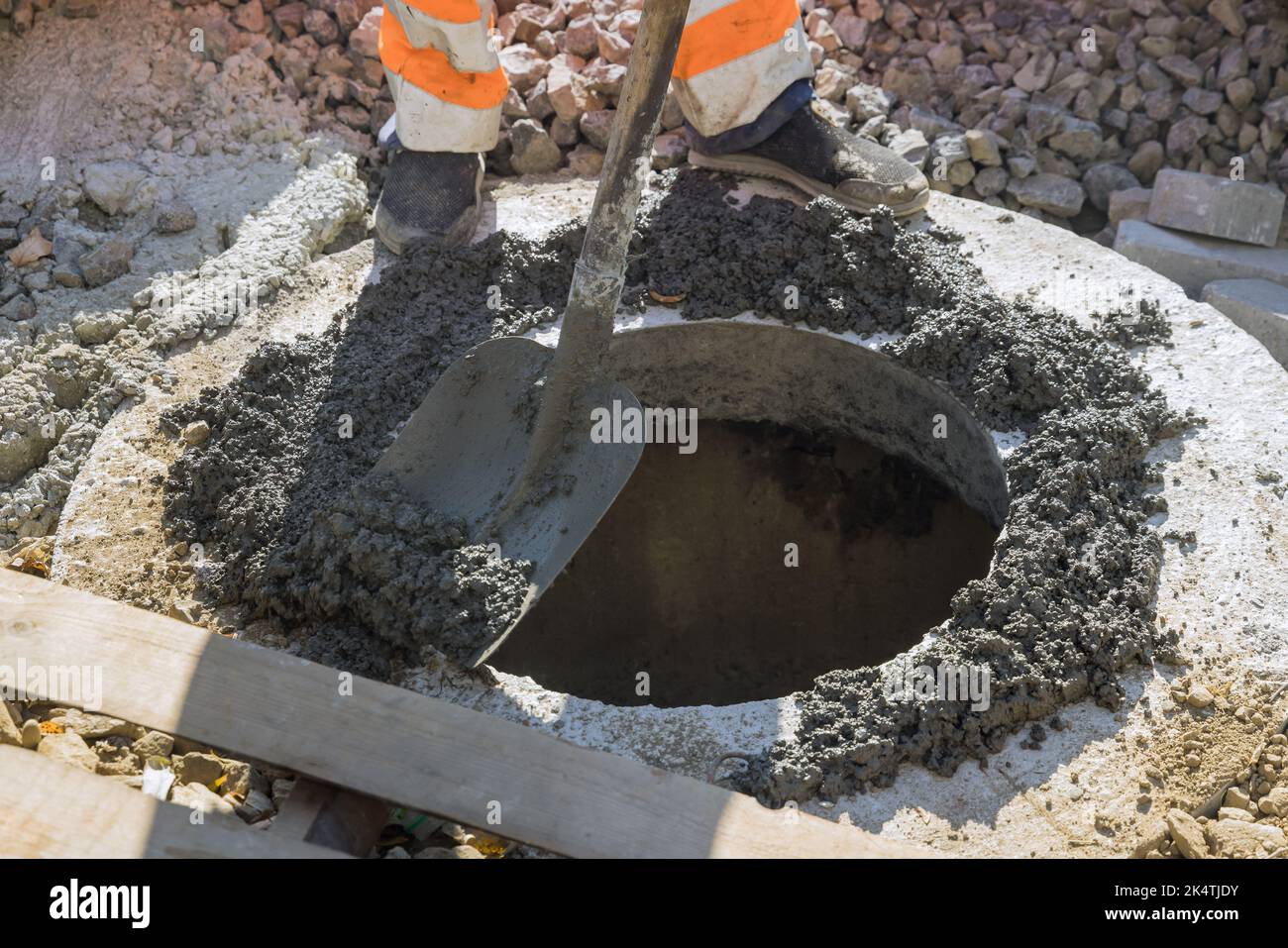 Utility worker construction pit for a septic tank the sewerage manhole ...