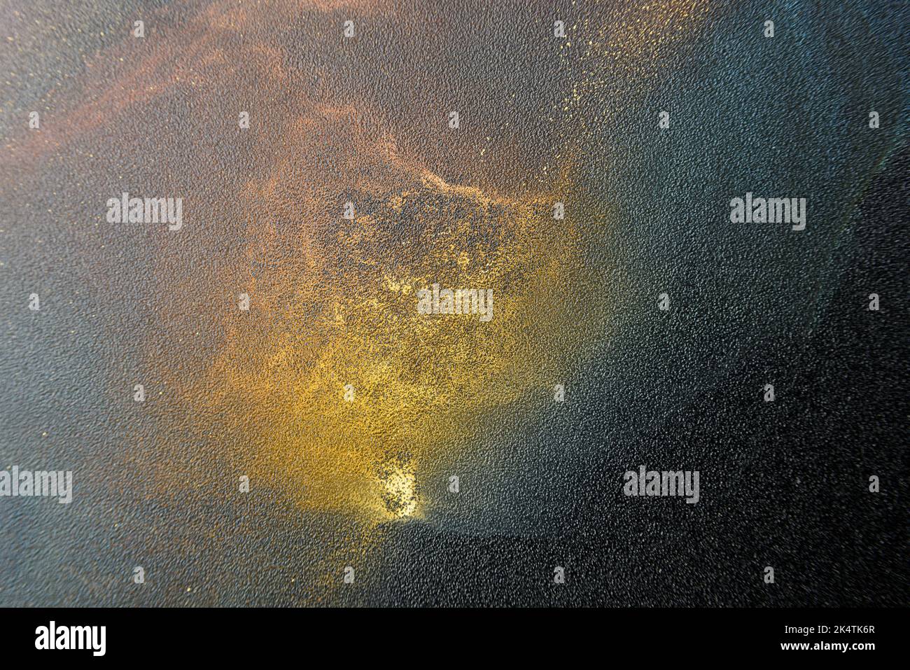 Abstract alcohol ink fluid art background on black. White, purple and ...