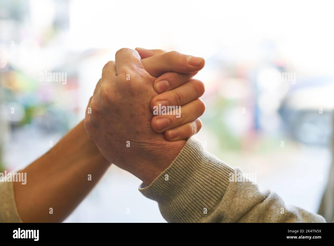 Two hands doing a cool handshake as a concept for friendship and trust ...