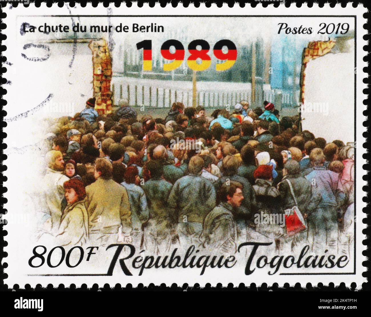 Fall of the Berlin Wall celebrated on postage stamp Stock Photo - Alamy
