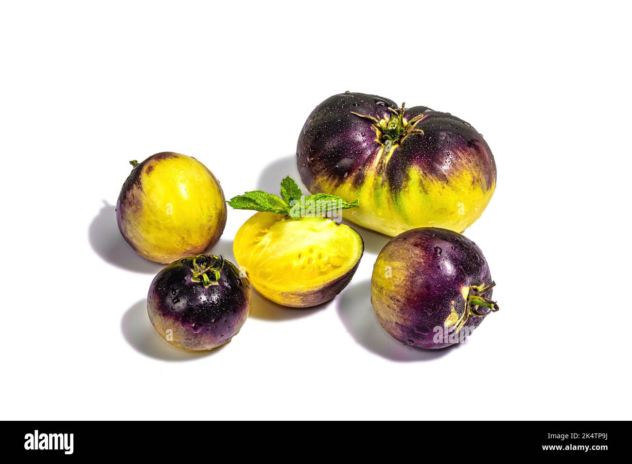 Yellow-violet Tomatoes variety Primary colors isolated on white ...