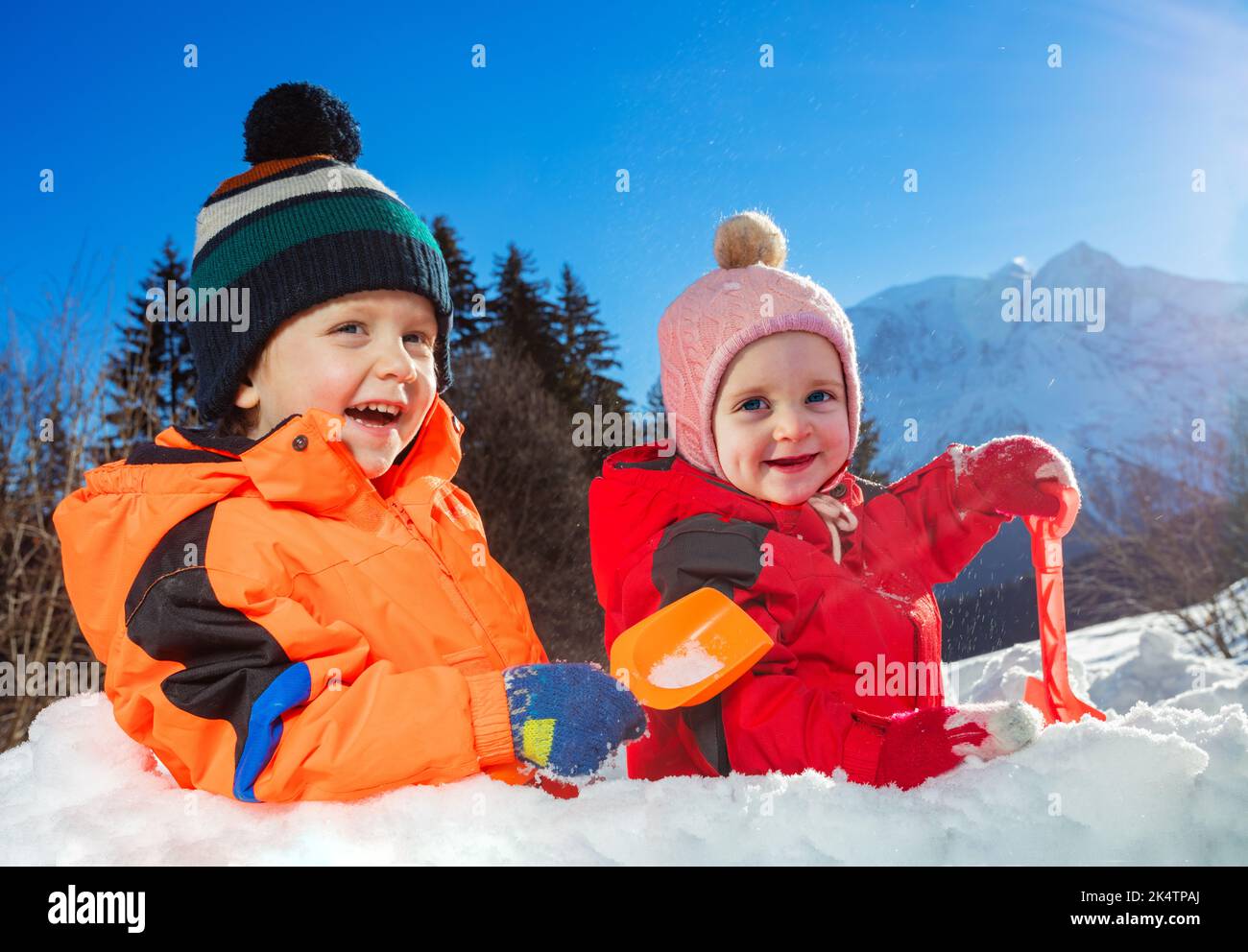 Child girl shovel snow hi-res stock photography and images - Alamy
