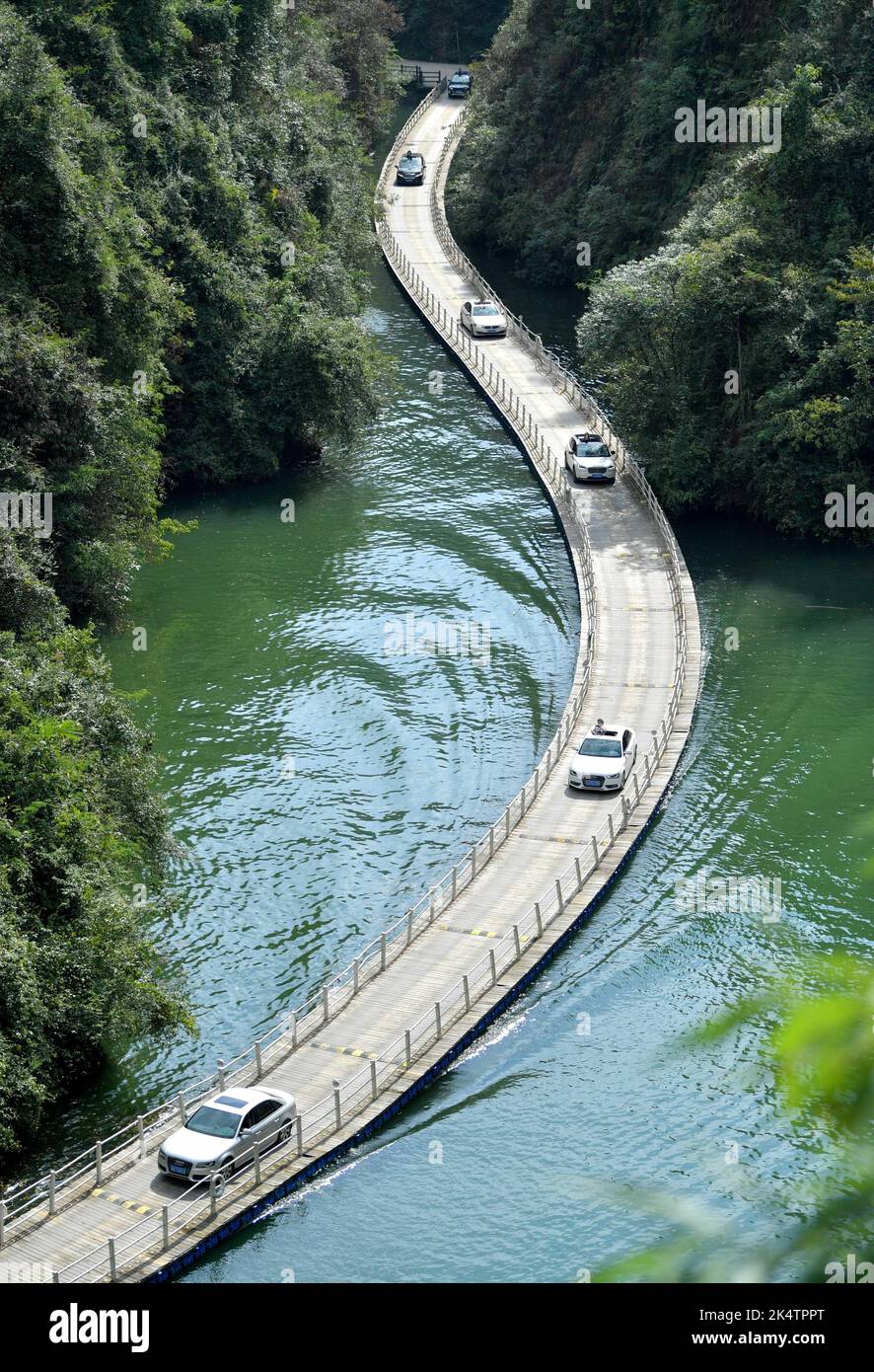 Enshi, China's Hubei Province. 4th Oct, 2022. Vehicles run on a bridge ...
