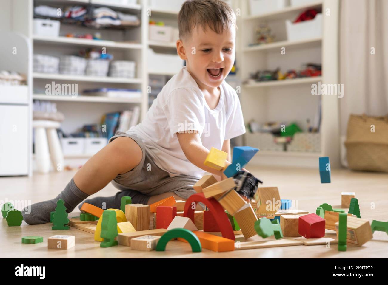 Baby playing with building bricks hi-res stock photography and images ...
