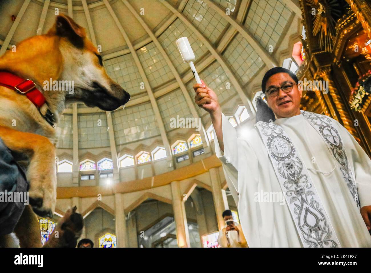 Antipolo, Philippines. 04th Oct, 2022. A priest blesses a dog during ...