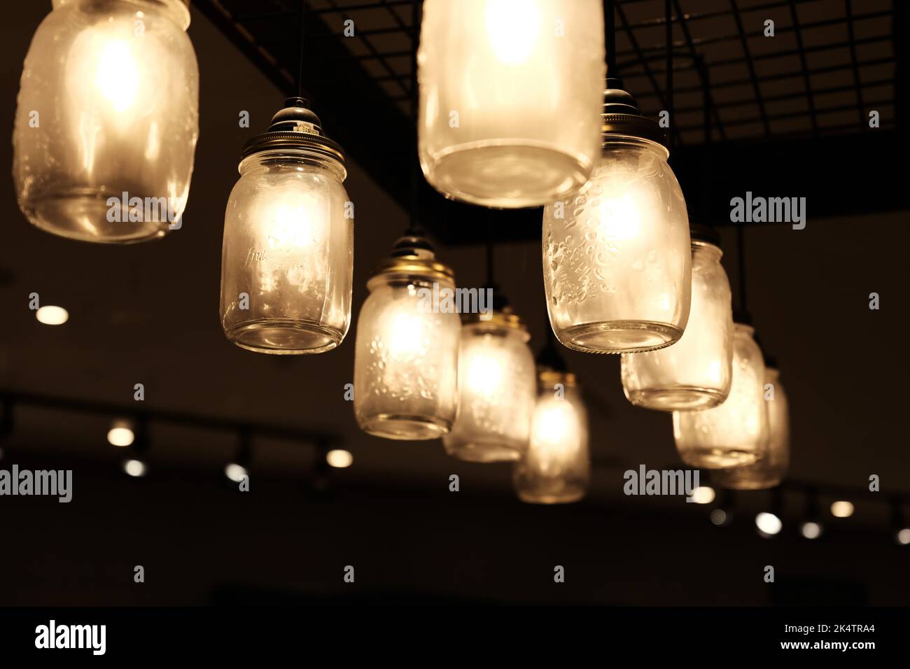 A lines of interior light decoration made from glass jars Stock Photo ...