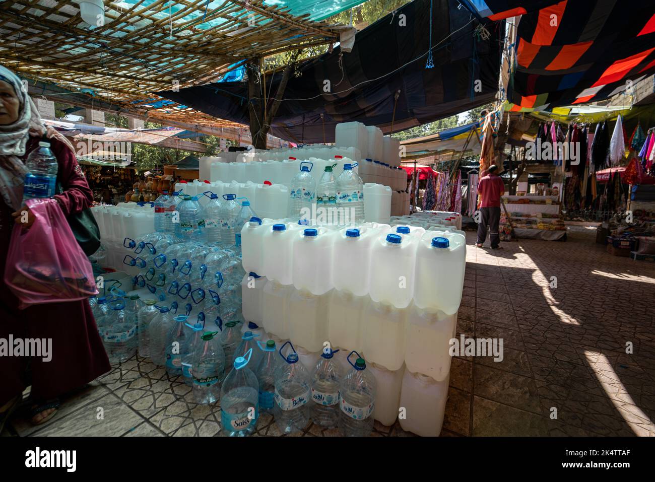 A stack of empty plastic water containers in Sidi Harazem Stock Photo ...