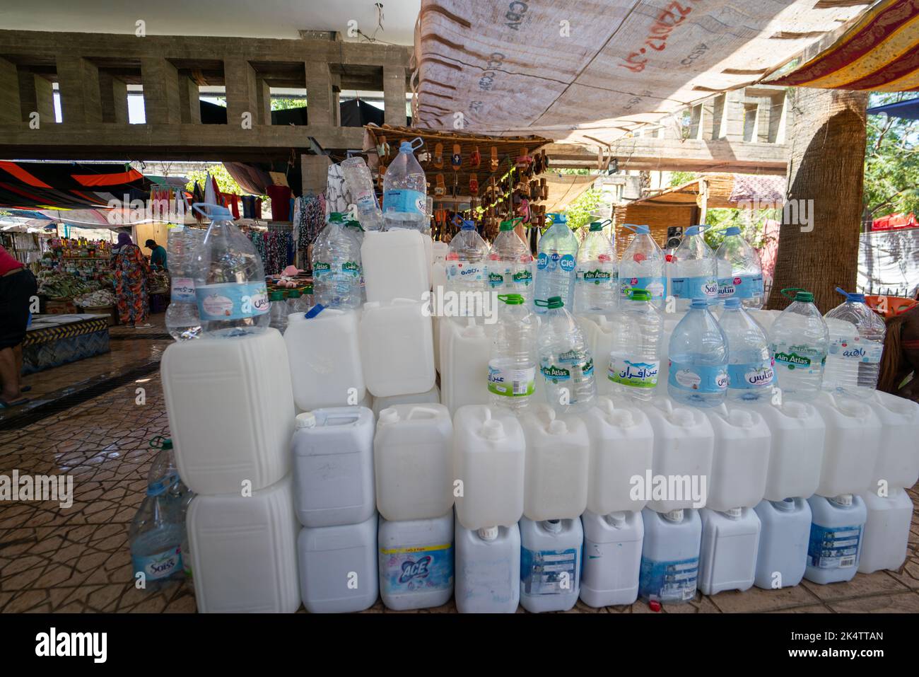 A stack of empty plastic water containers in Sidi Harazem Stock Photo ...