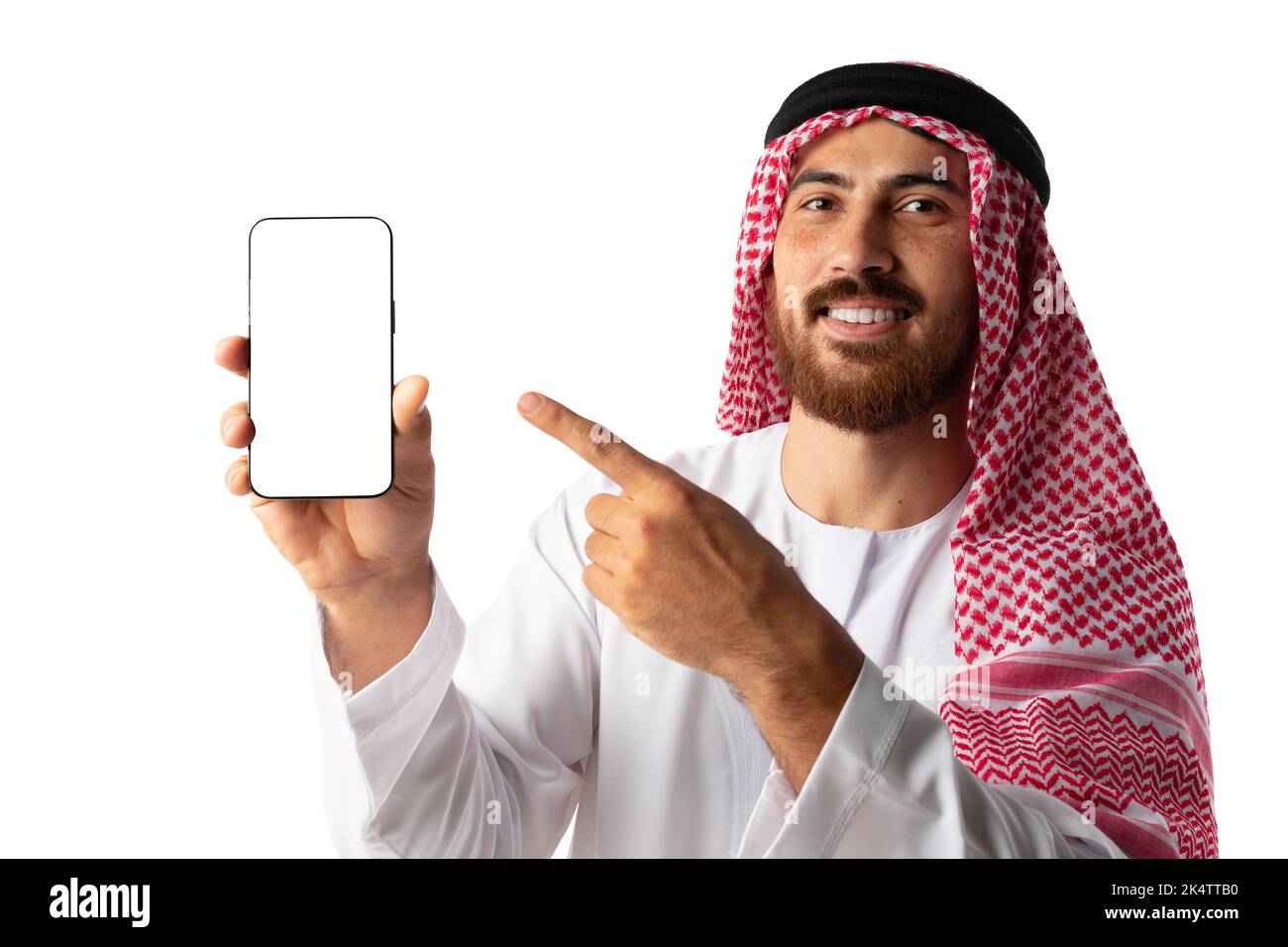 Young Arab muslim man in traditional clothes showing mobile phone ...