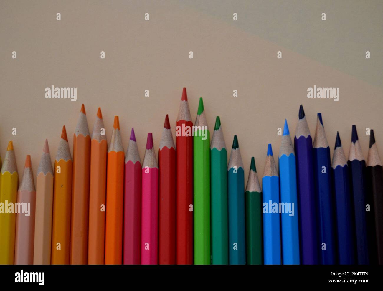 Set of colored pencils lined up forming a curve Stock Photo - Alamy